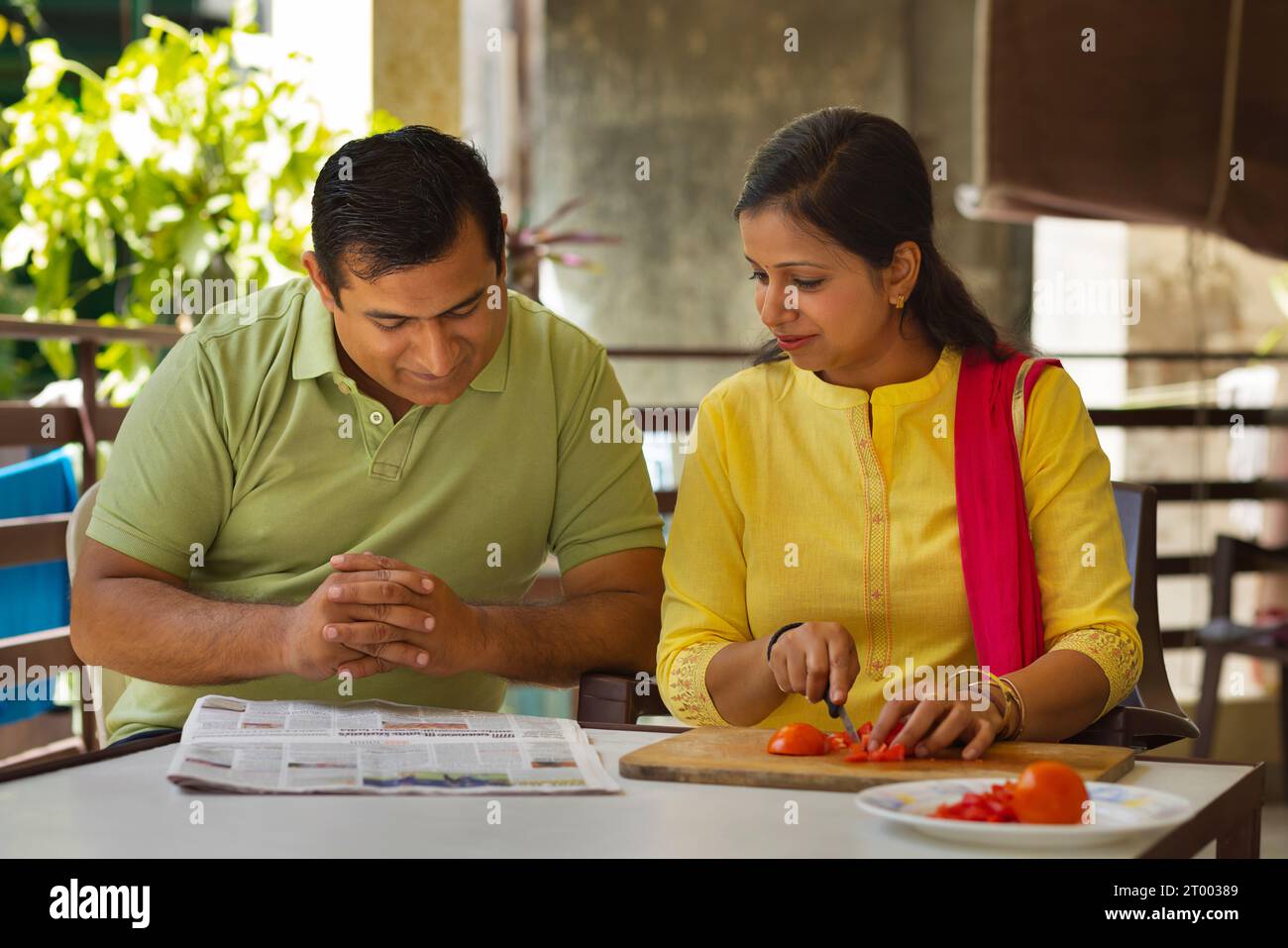 Woman reading newspaper man housework hi-res stock photography and ...