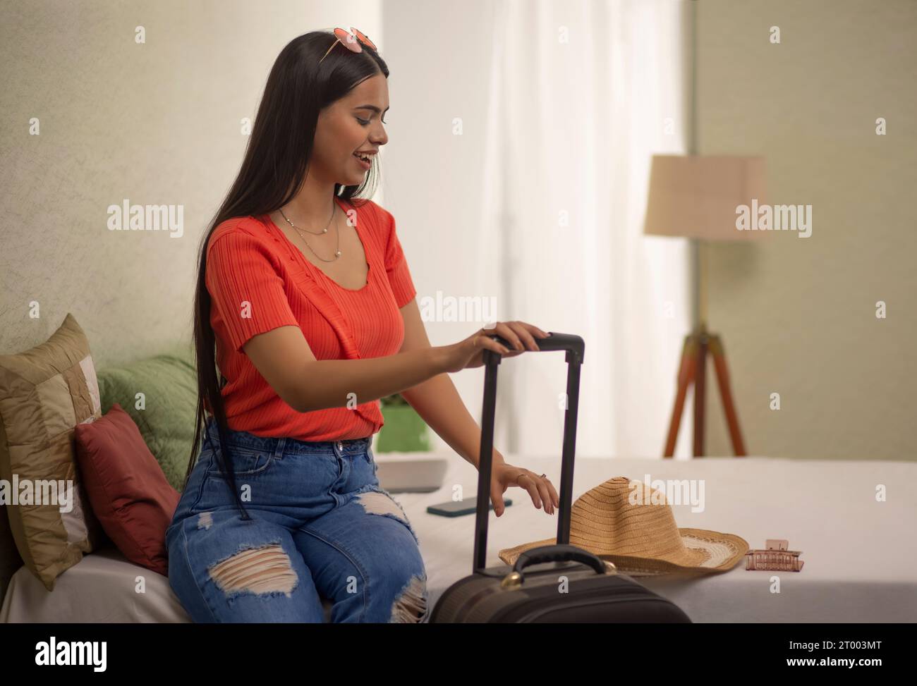 Woman with packed suitcase ready for vacation Stock Photo - Alamy