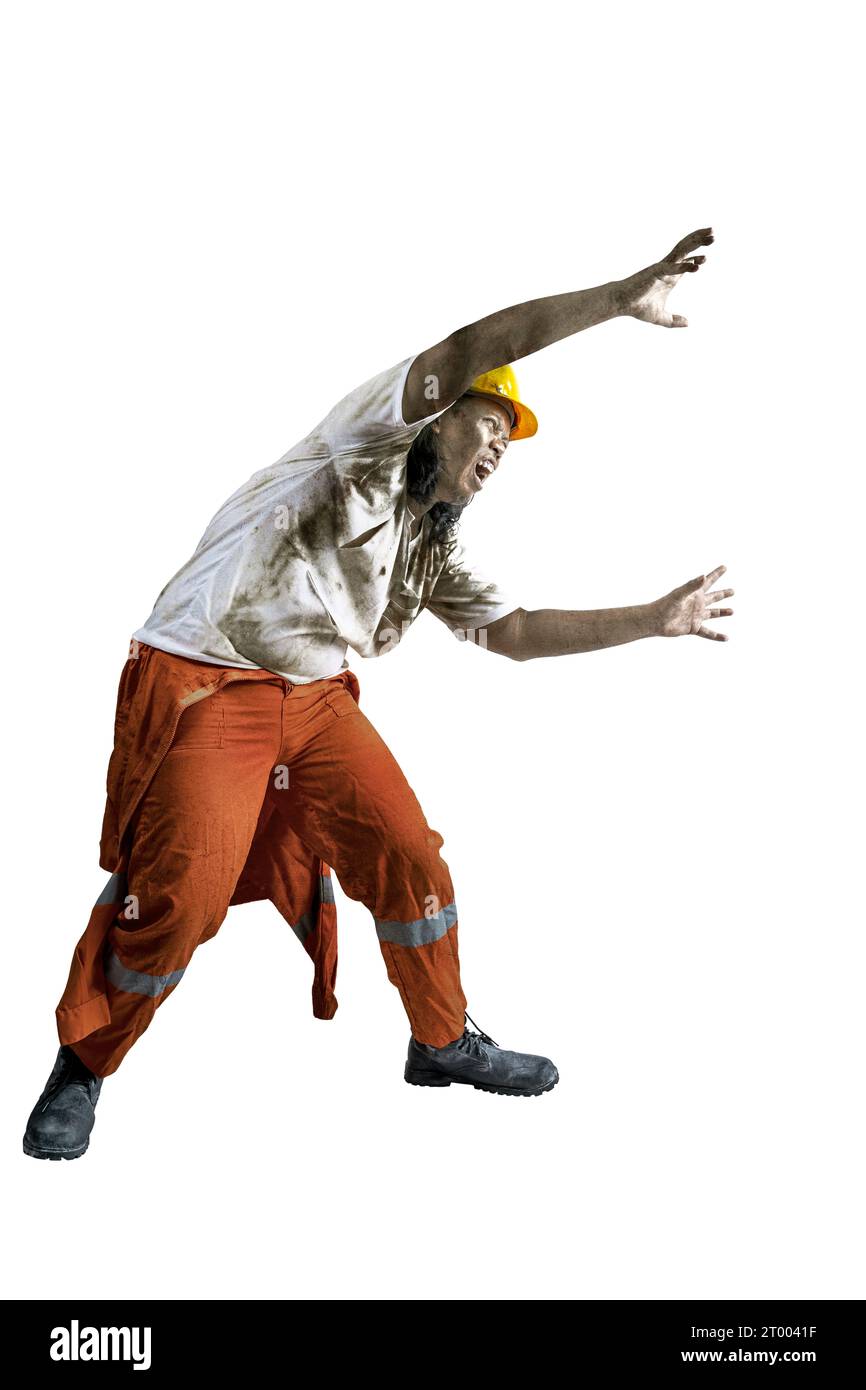 A scary construction worker zombie with blood and wounds on his body ...
