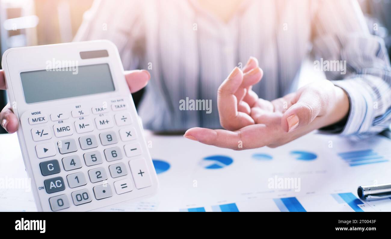 Business accounting women work with calculator and Laptop. Financial ...