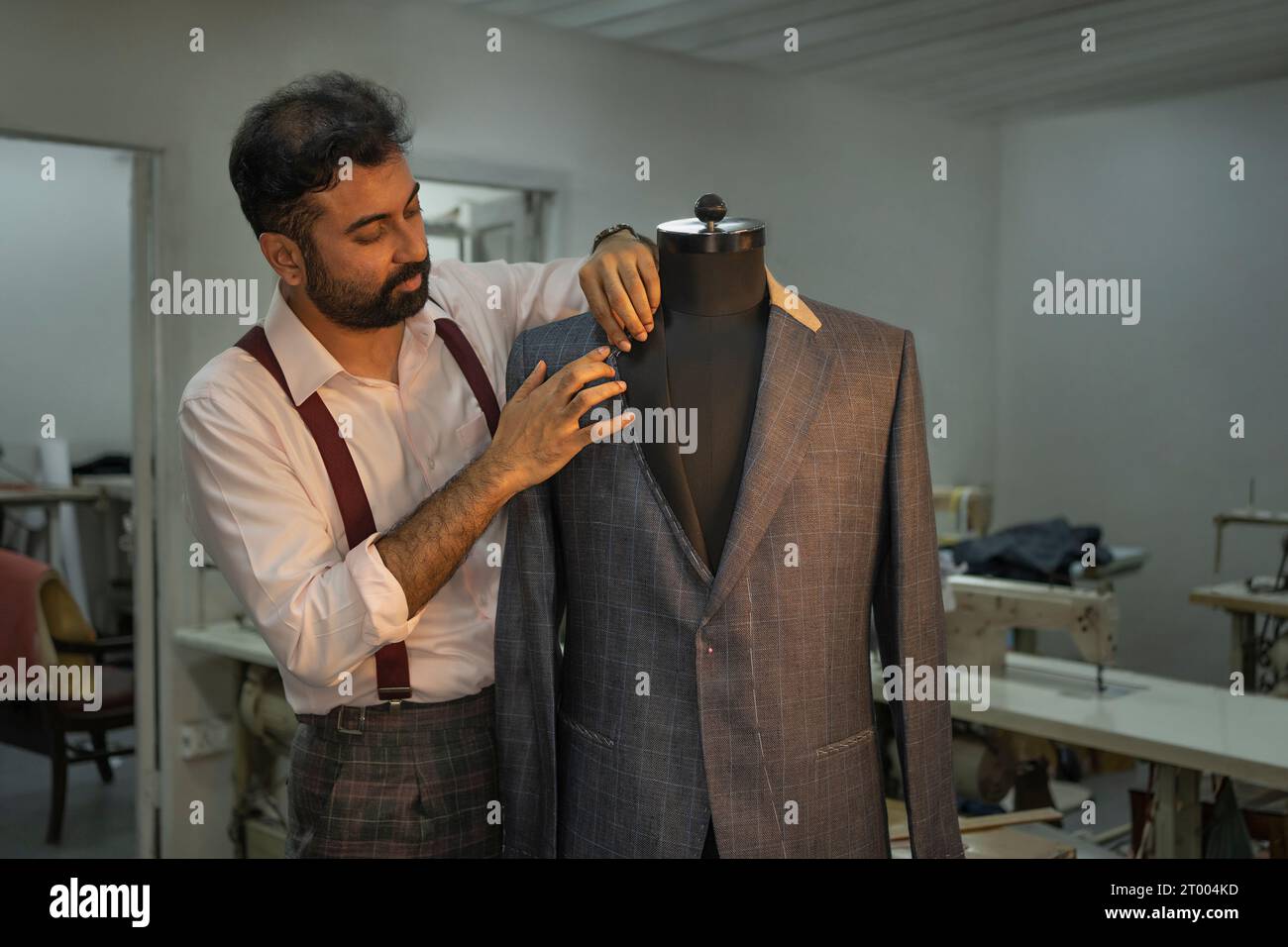 Tailor marking changes on a handmade jacket Stock Photo - Alamy