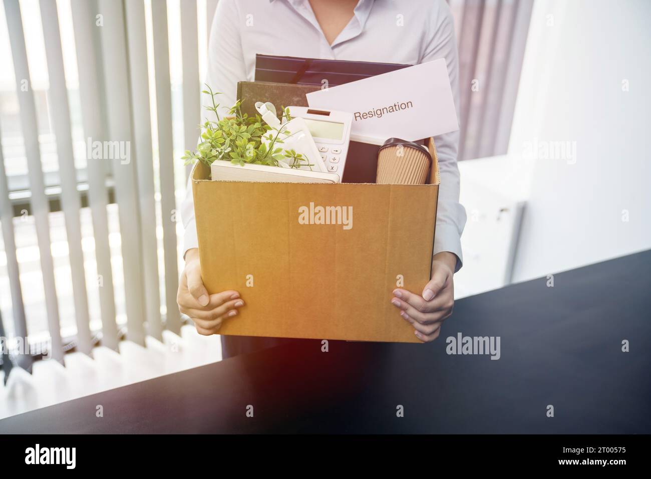 Leaving work carrying box hi-res stock photography and images - Alamy