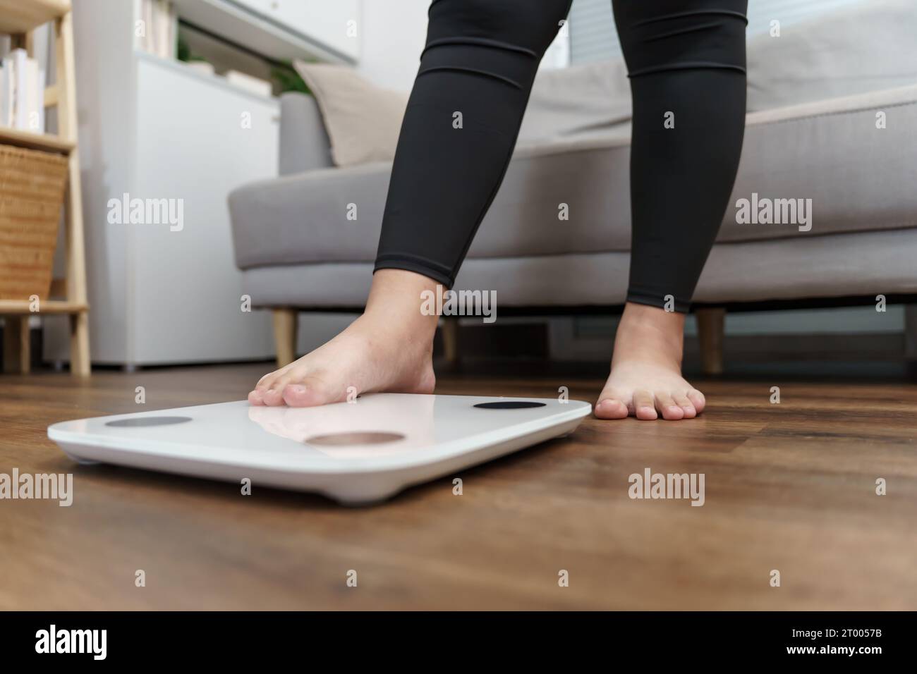 Fat diet and scale feet standing on electronic scales for weight ...