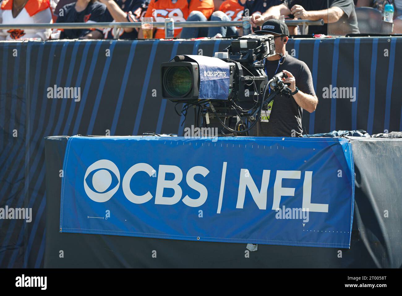 A television camera operator for CBS Sports is seen during the first ...