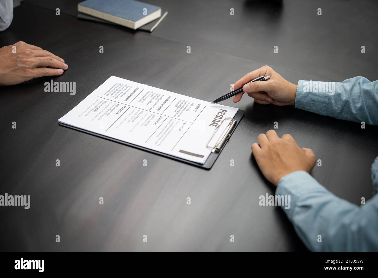 Examiner reading a resume during job interview at office Business and ...