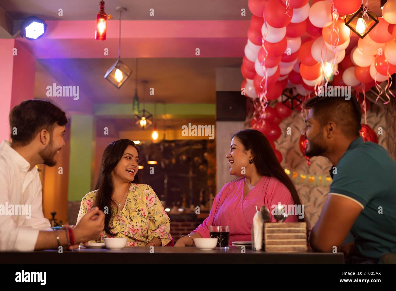 Friends celebrating birthday at restaurant Stock Photo - Alamy