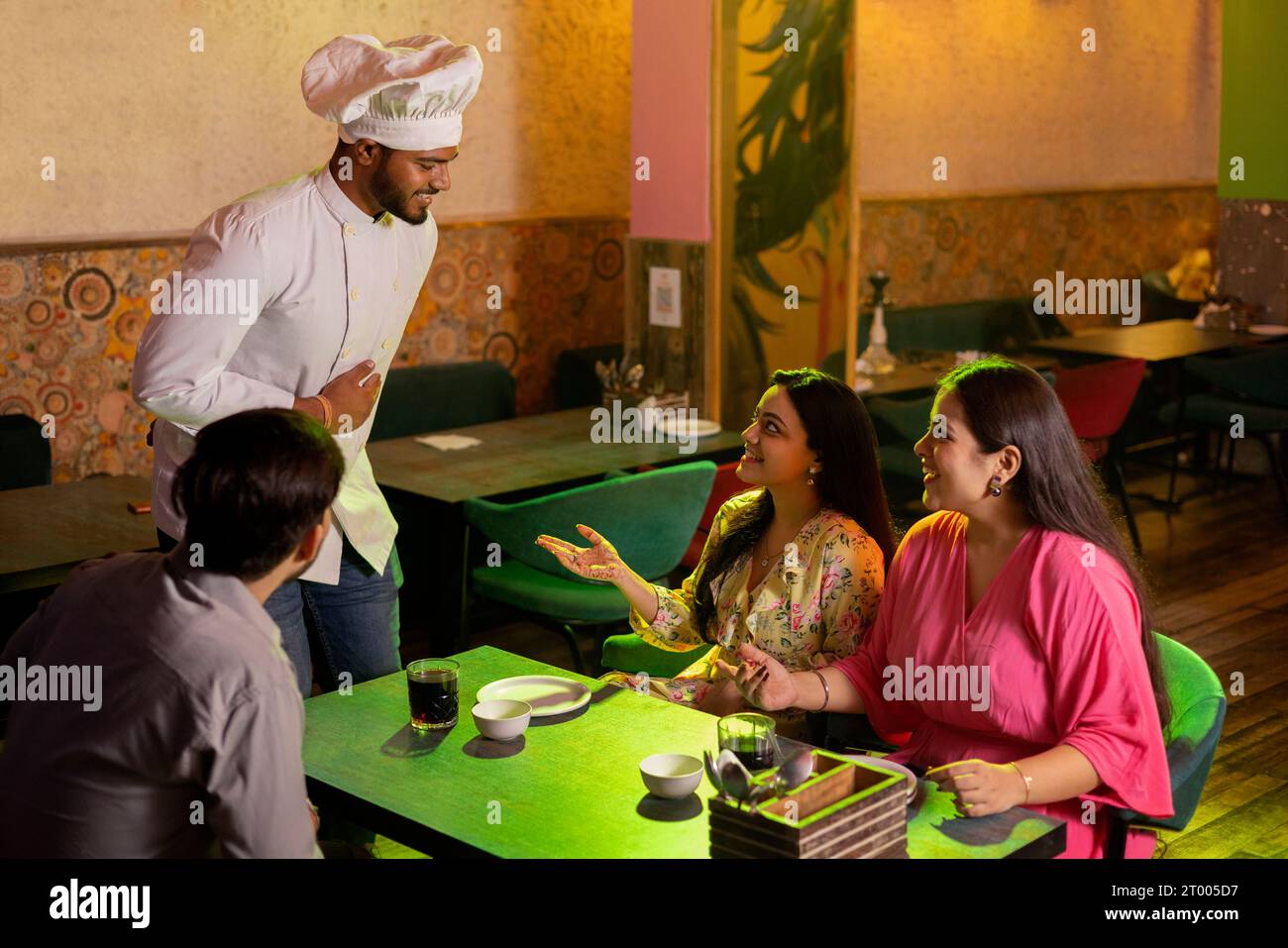 Indian chef serving food in restaurant hi-res stock photography and ...