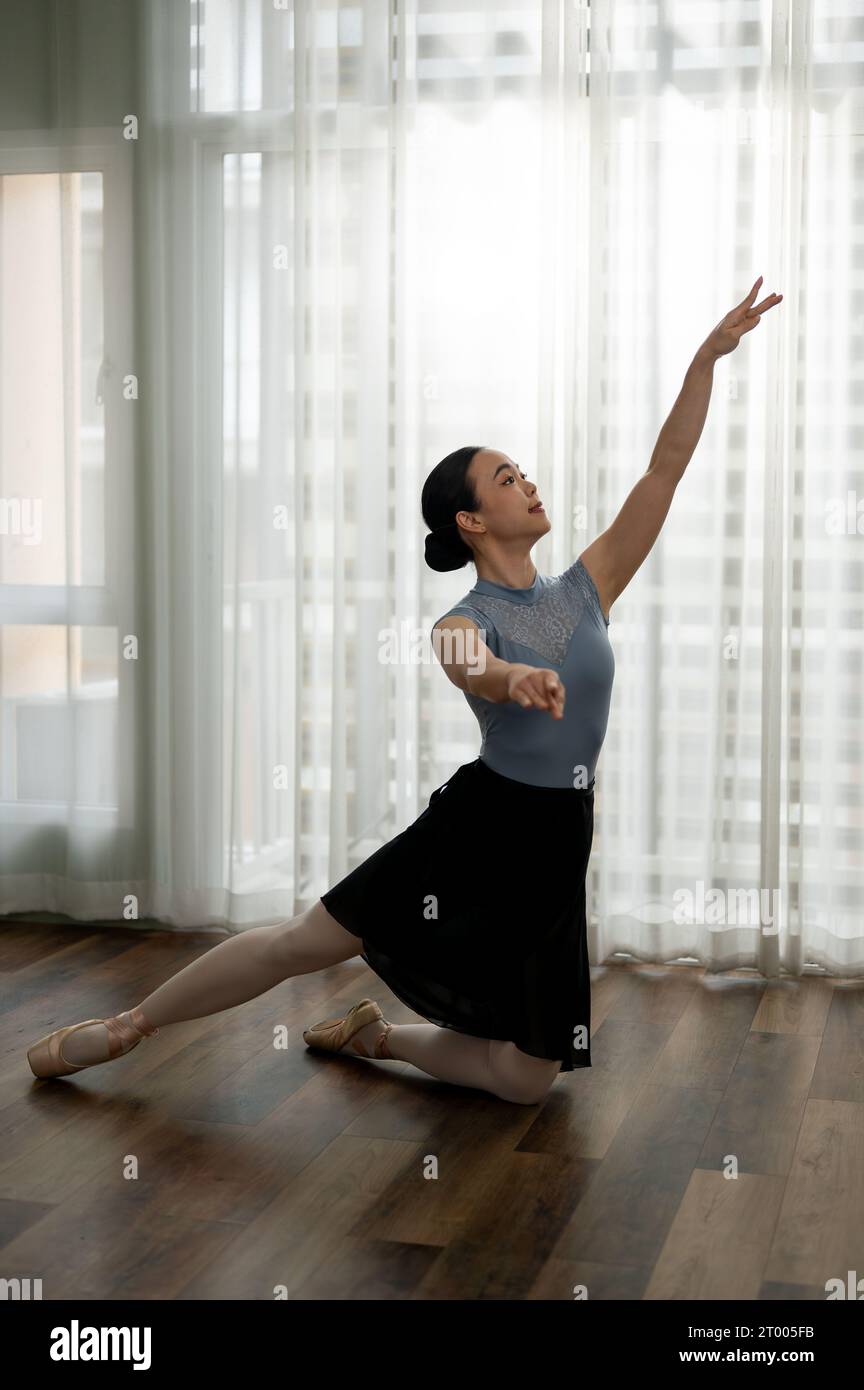 Young girl practicing ballet dancing at modern apartment. Young ...