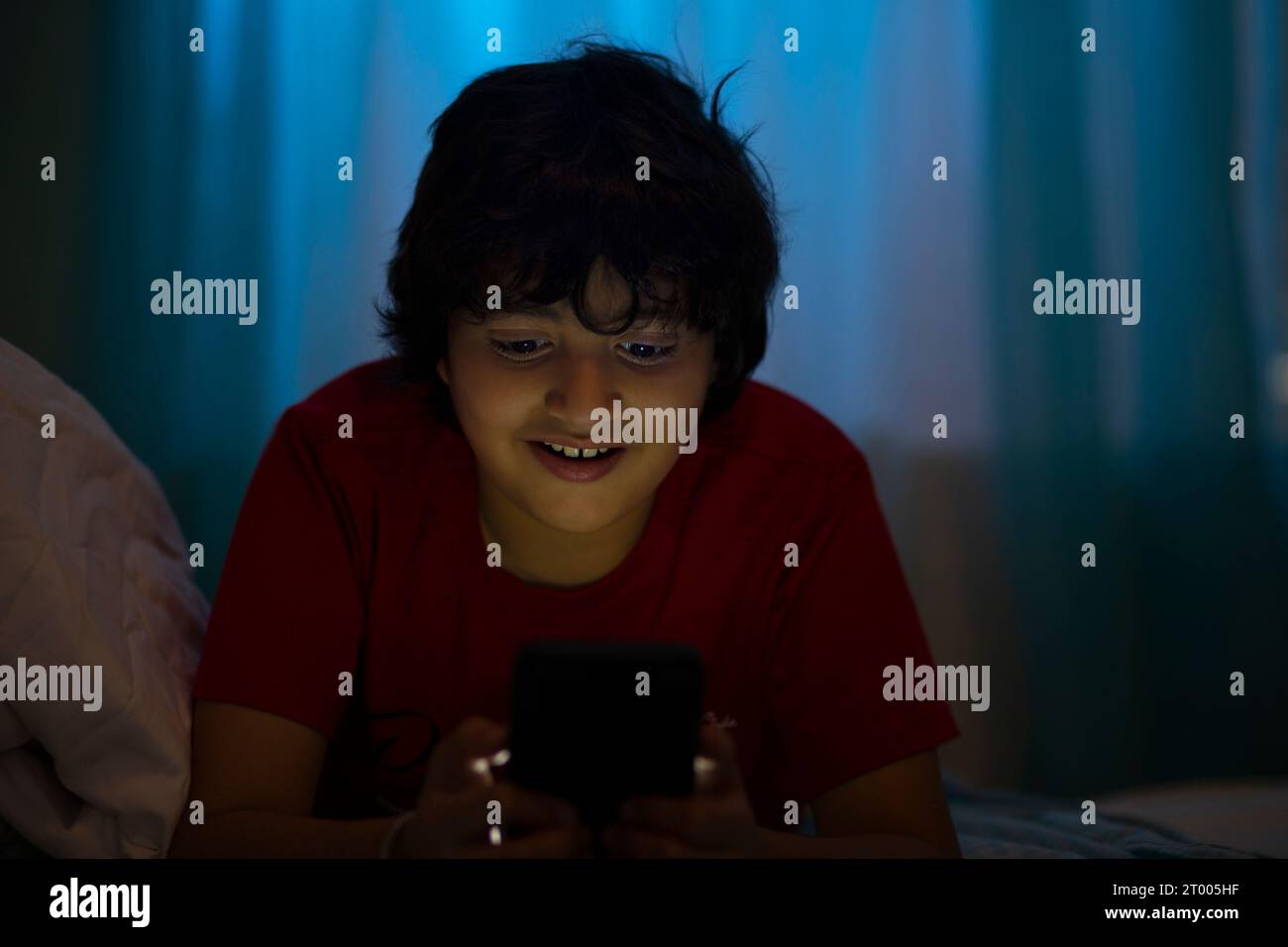 Asian boy holding phone hi-res stock photography and images - Alamy