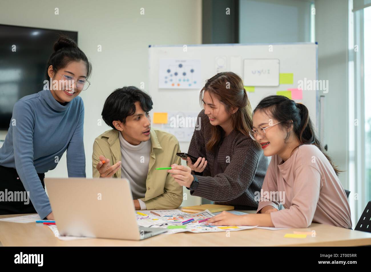 Team of young professional UX/UI designer working together in the ...