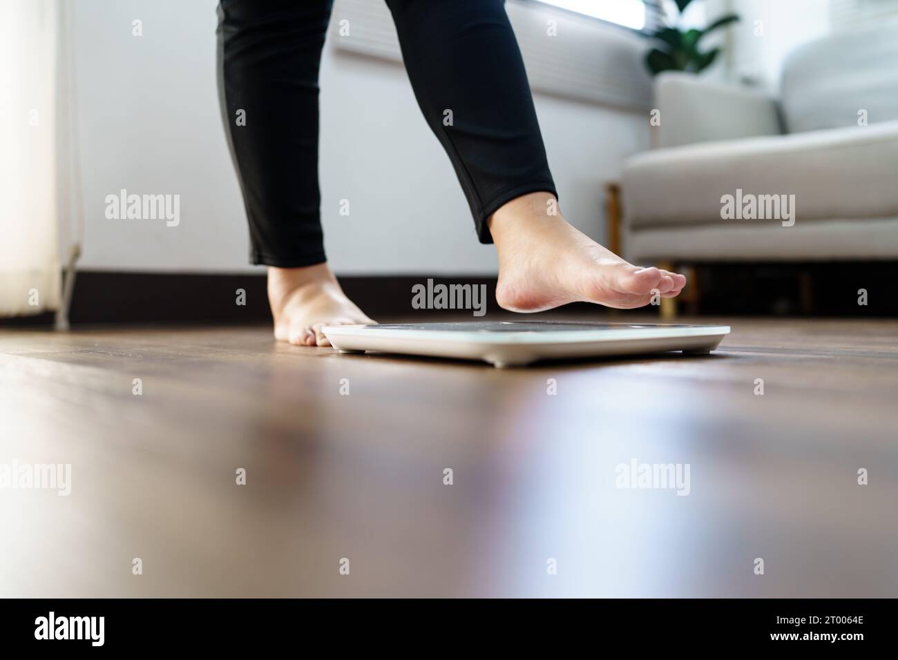 Lose weight. Fat diet and scale feet standing on electronic scales for ...