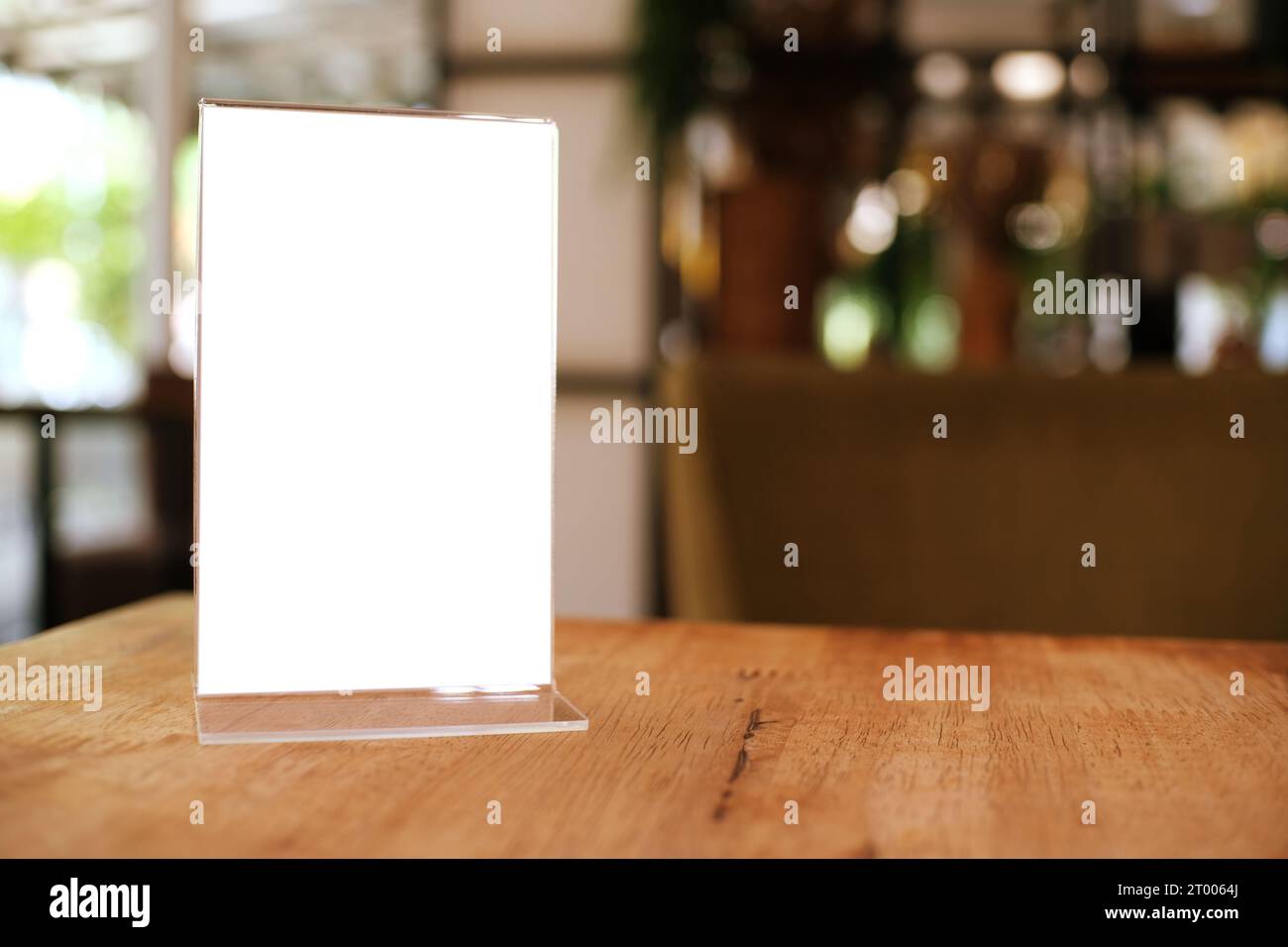 Menu frame standing on wood table in Bar restaurant cafe. space for ...