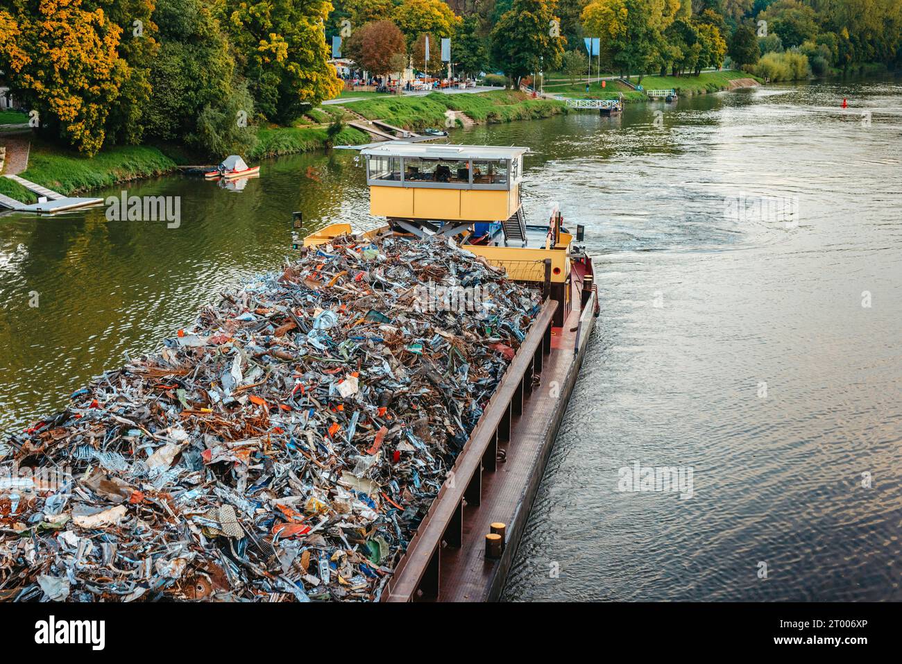 Transportation industry. Ship barge transports scrap metal and sand ...