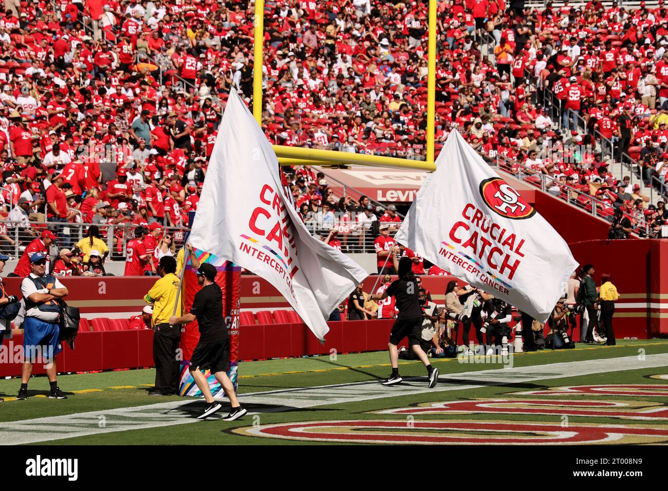 A flag that reads Crucial Catch is carried across the field during an ...
