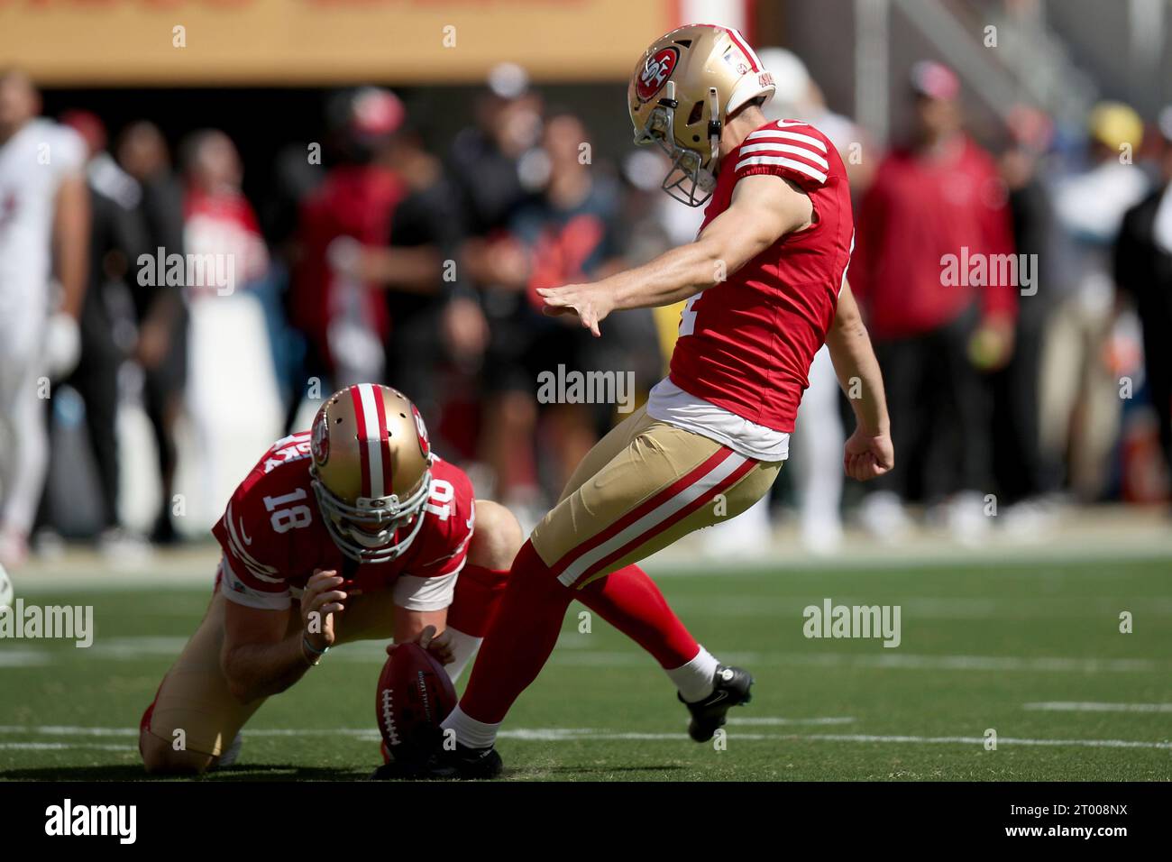 San Francisco 49ers holder Mitch Wishnowsky (18) sets the ball as place ...