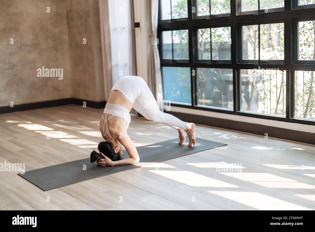 Beautiful fit asian woman stretching hi-res stock photography and ...