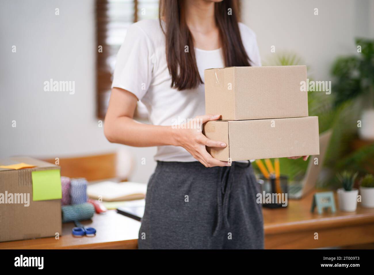 Asian woman preparing package delivery box Shipping for shopping online ...