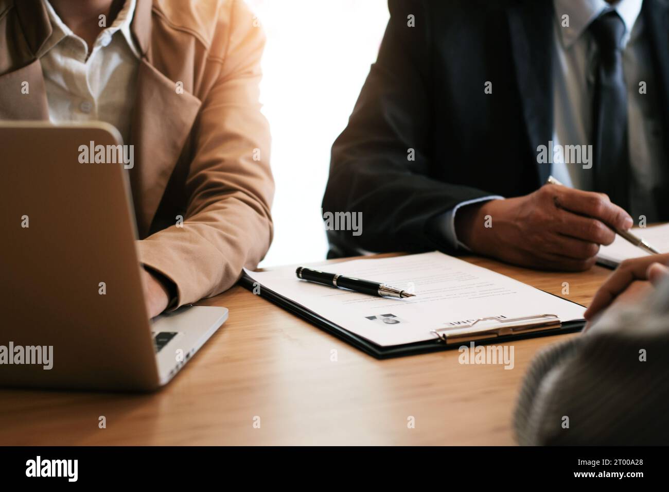 Examiner reading a resume during job interview at office Business and ...