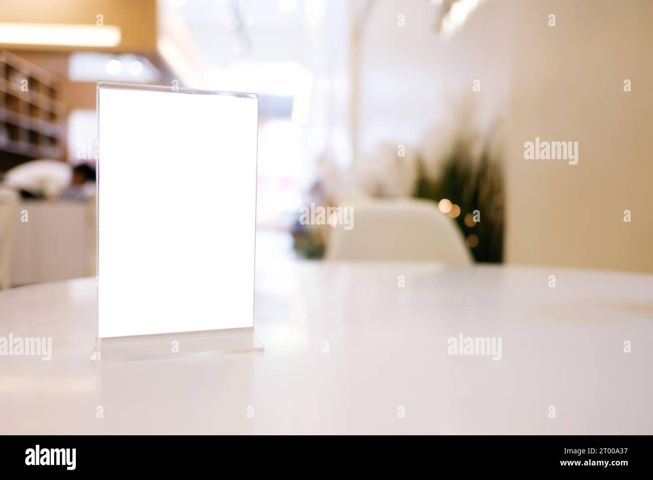 Menu frame standing on wood table in Bar restaurant cafe. space for ...