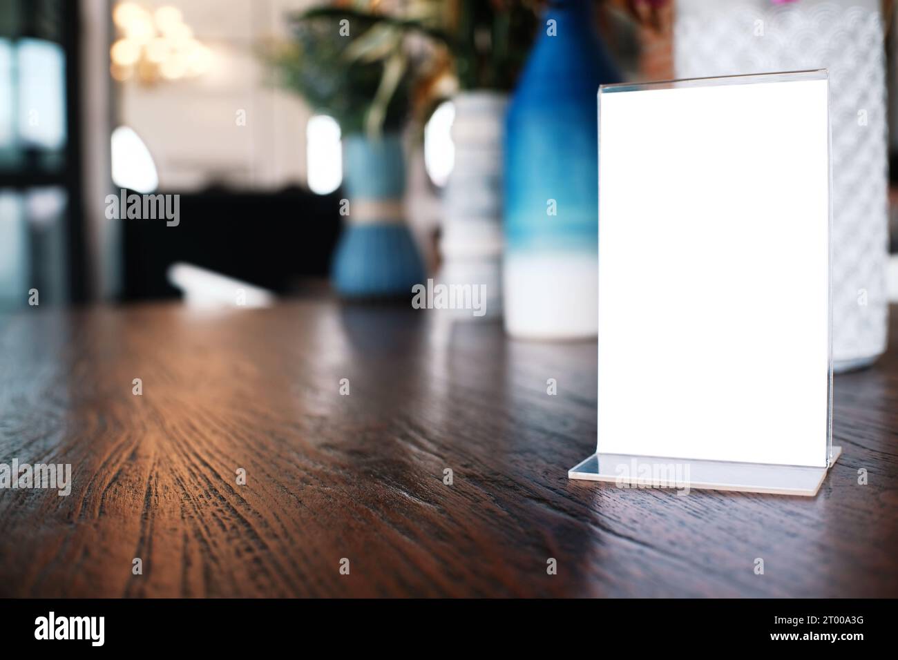 Menu frame standing on wood table in Bar restaurant cafe. space for ...