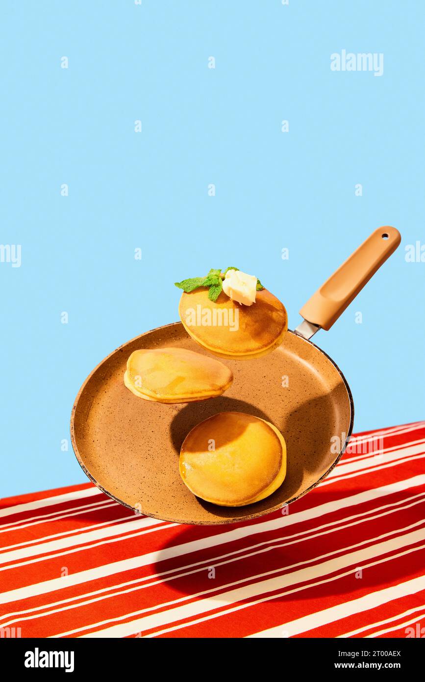 Food pop art photography. Close up. Flying frying pan with hot, sweet ...
