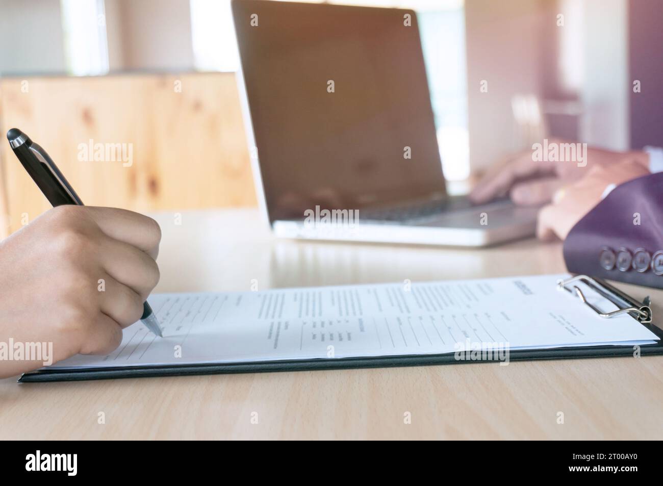 Man Completing Application Form during job interview. human resources ...