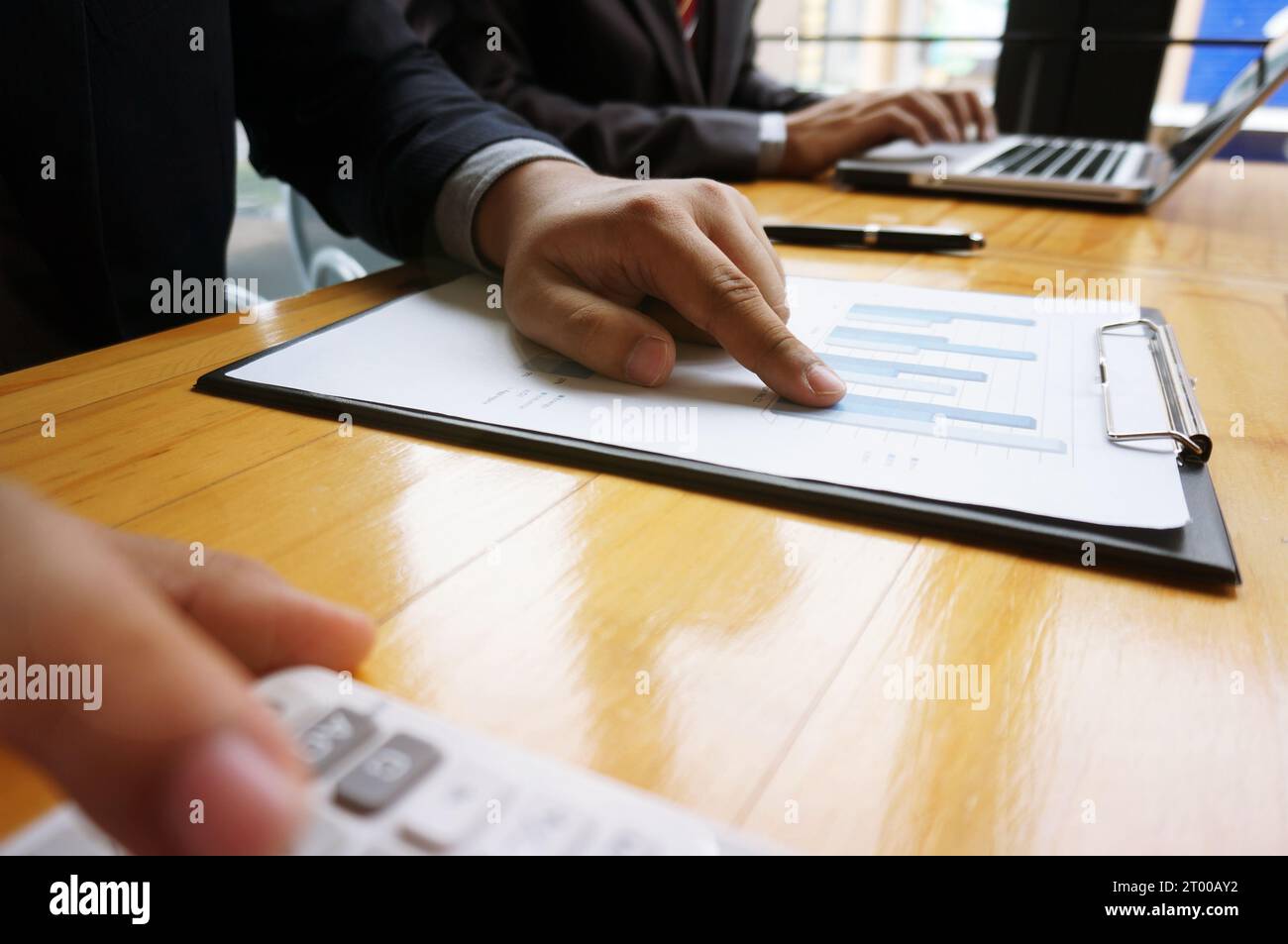Hands of business people analyzing chart Finance managers task Stock ...