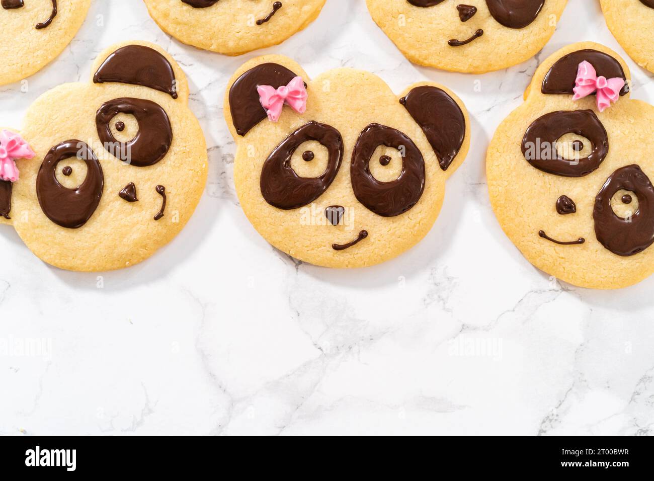 Panda shaped shortbread cookies with chocolate icing Stock Photo - Alamy
