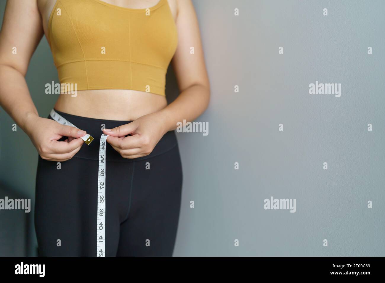 Woman want to lose weight with a centimeter Shape up healthy stomach ...