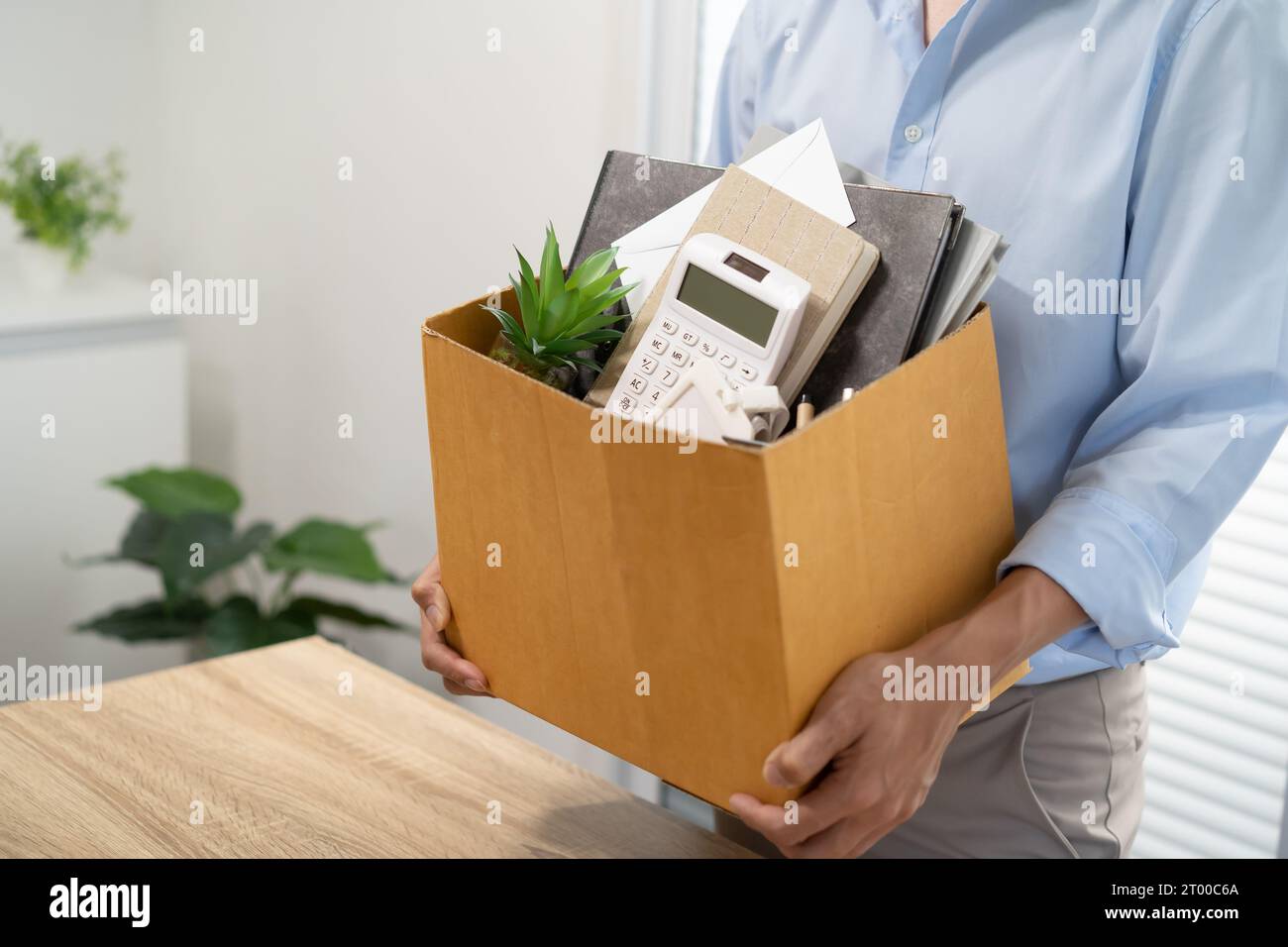 Business man sending resignation letter and packing Stuff Resign ...