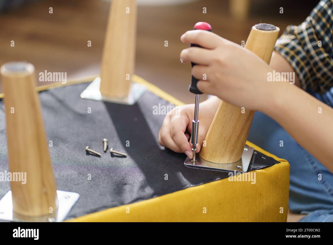 Asian Woman self repairs furniture renovation using equipment to diy ...