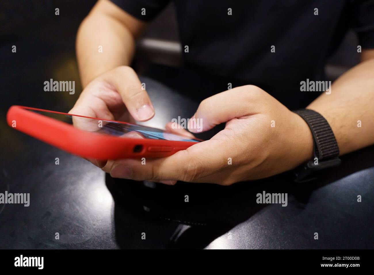 Man playing game on mobile phone. gamer boy playing video games holding ...
