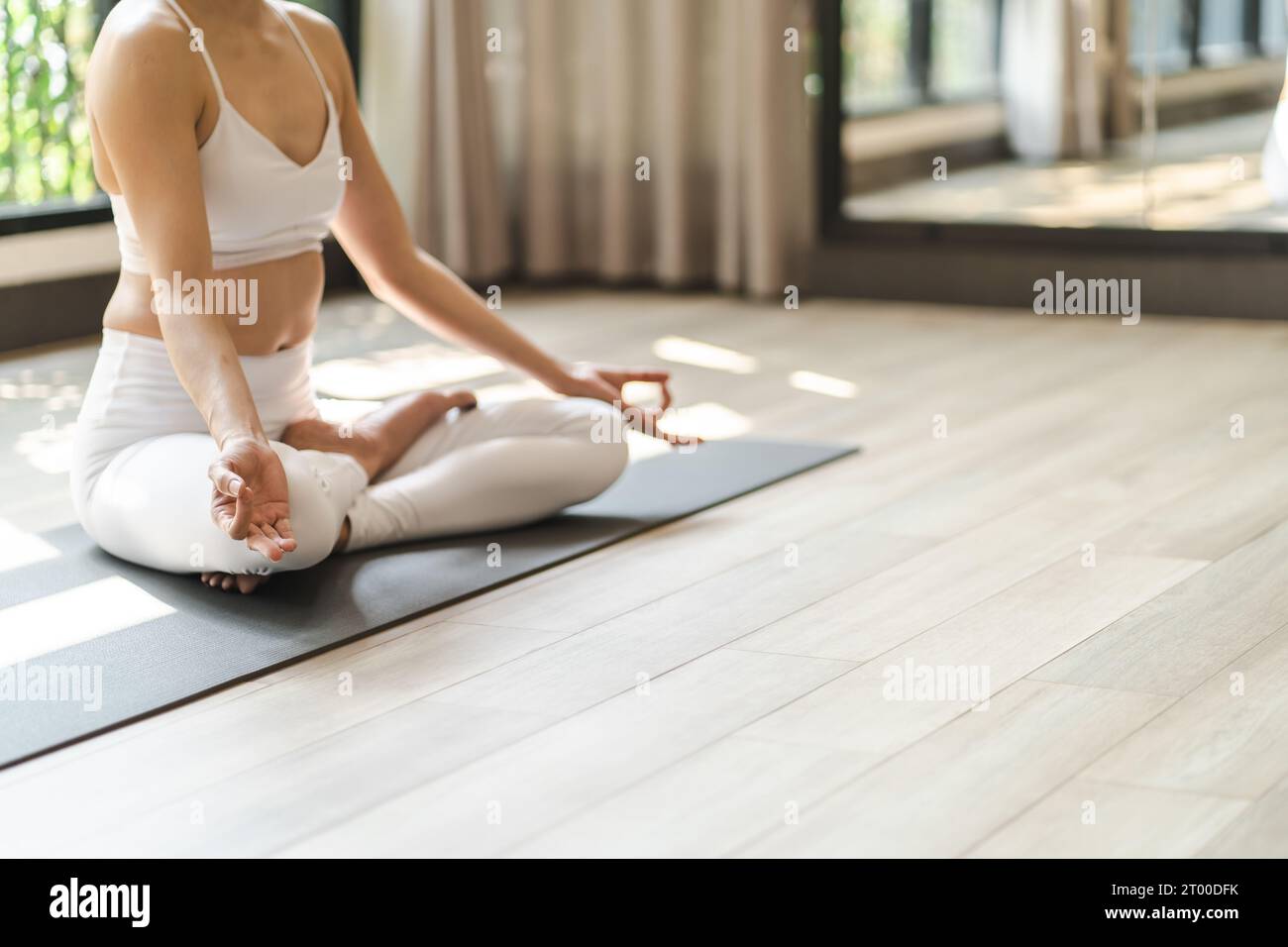 Easy Seat pose Female Attractive asian woman doing yoga stretching ...