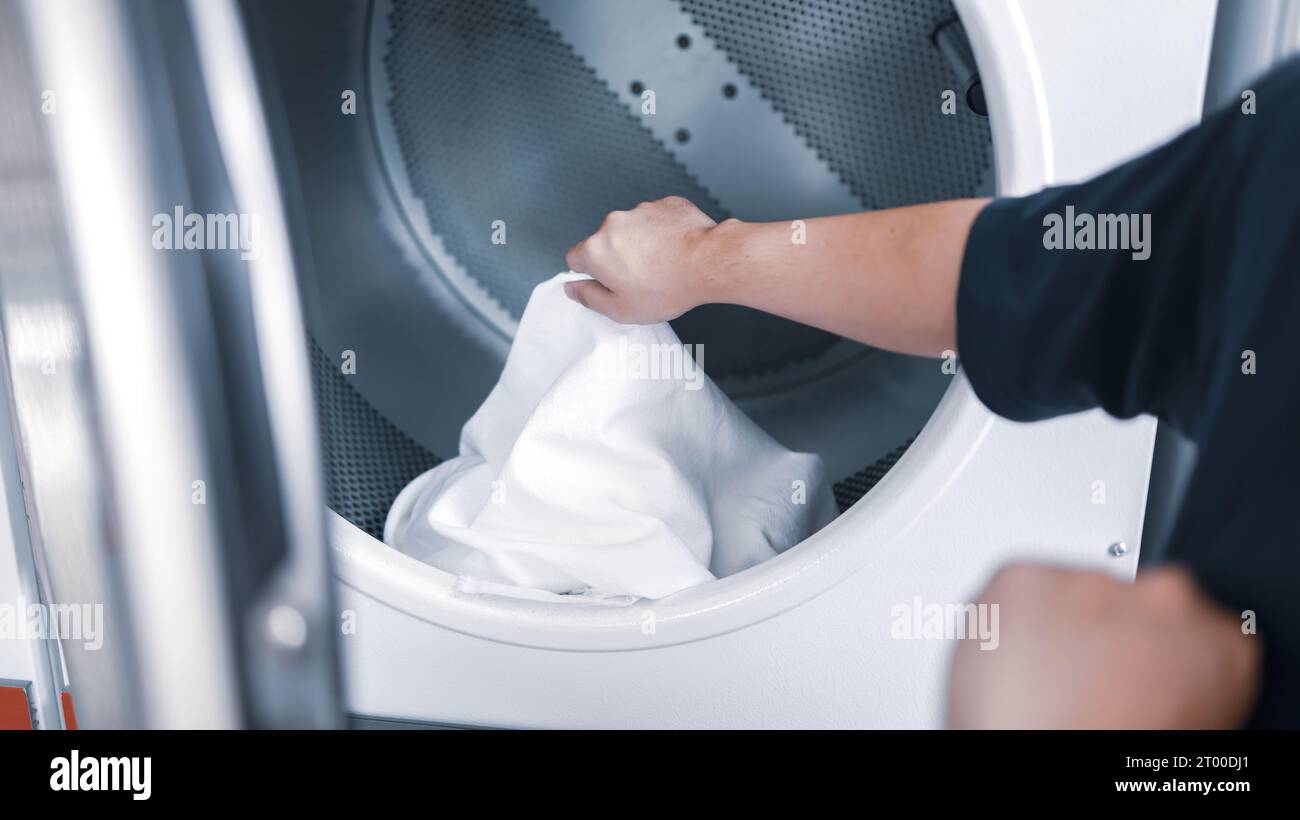 Man doing launder holding basket with dirty laundry of the washing ...