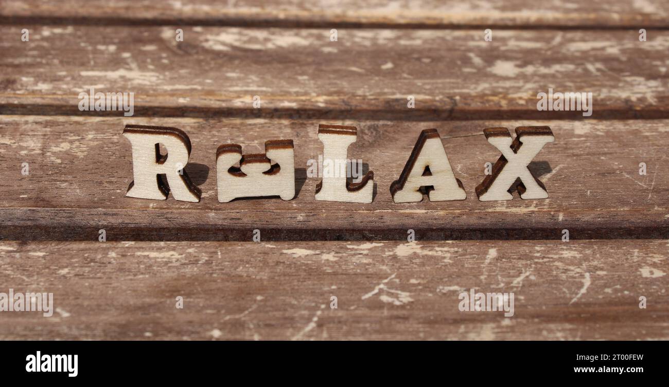 nature wooden letters in the sun on a sunny happy day. create word text ...