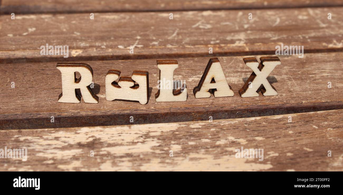 nature wooden letters in the sun on a sunny happy day. create word text ...