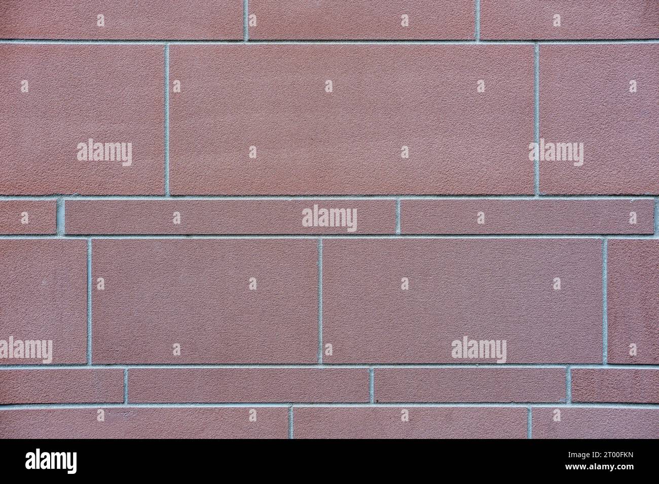 Background from a wall with rectangular reddish brown stone slabs Stock ...