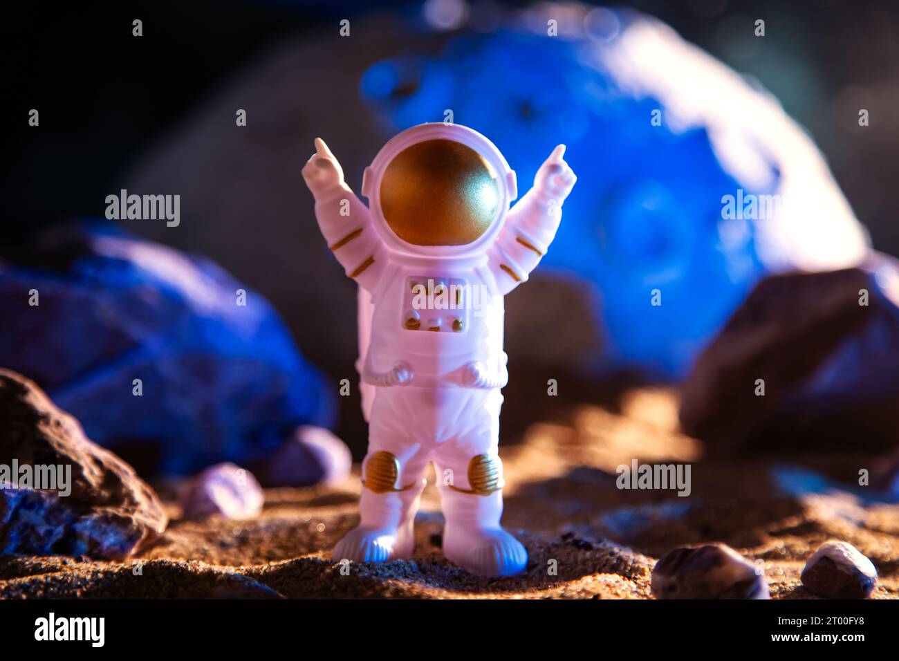 Astronaut in a space suit raised his hands in a sign of welcome on ...