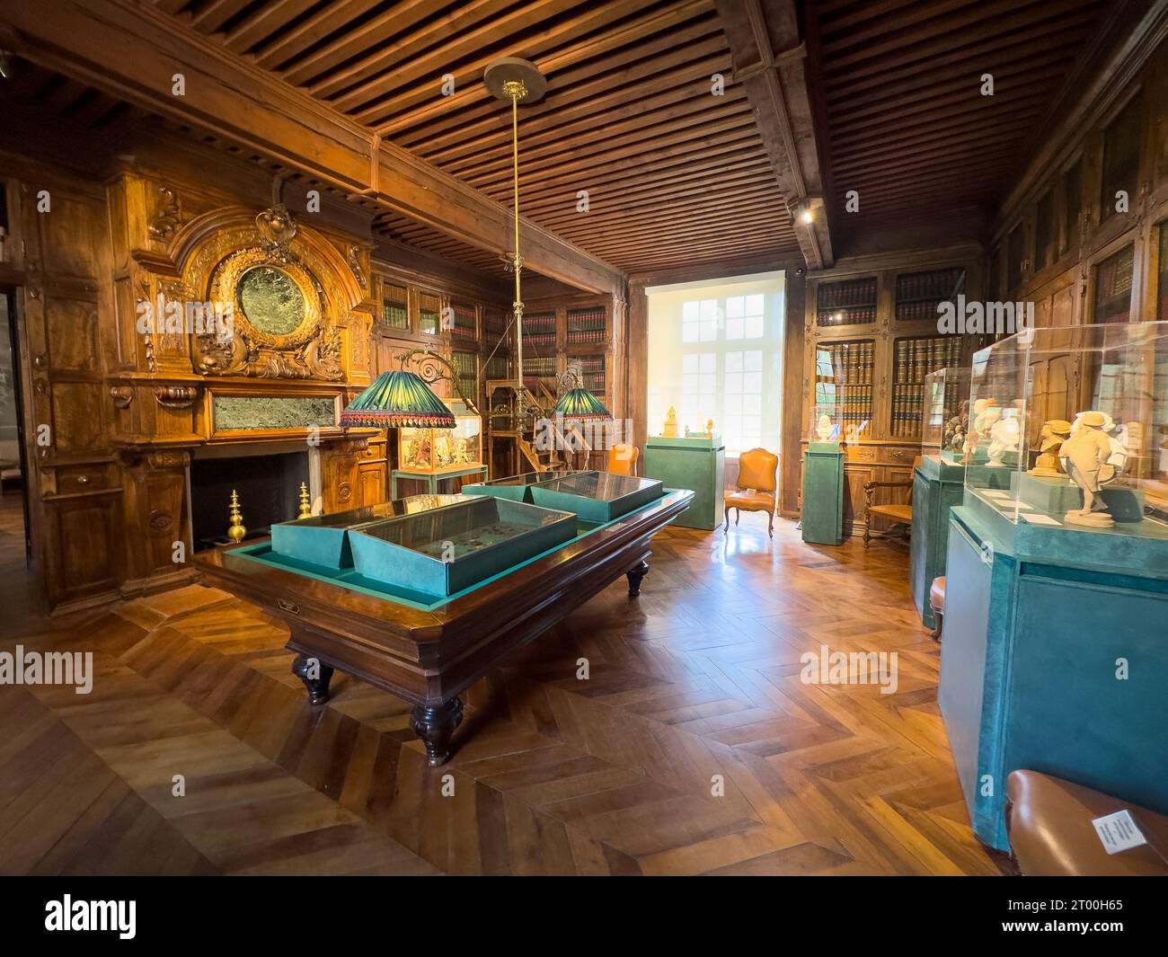 An elaborate and ornate wooden display room featuring carvings and an ...