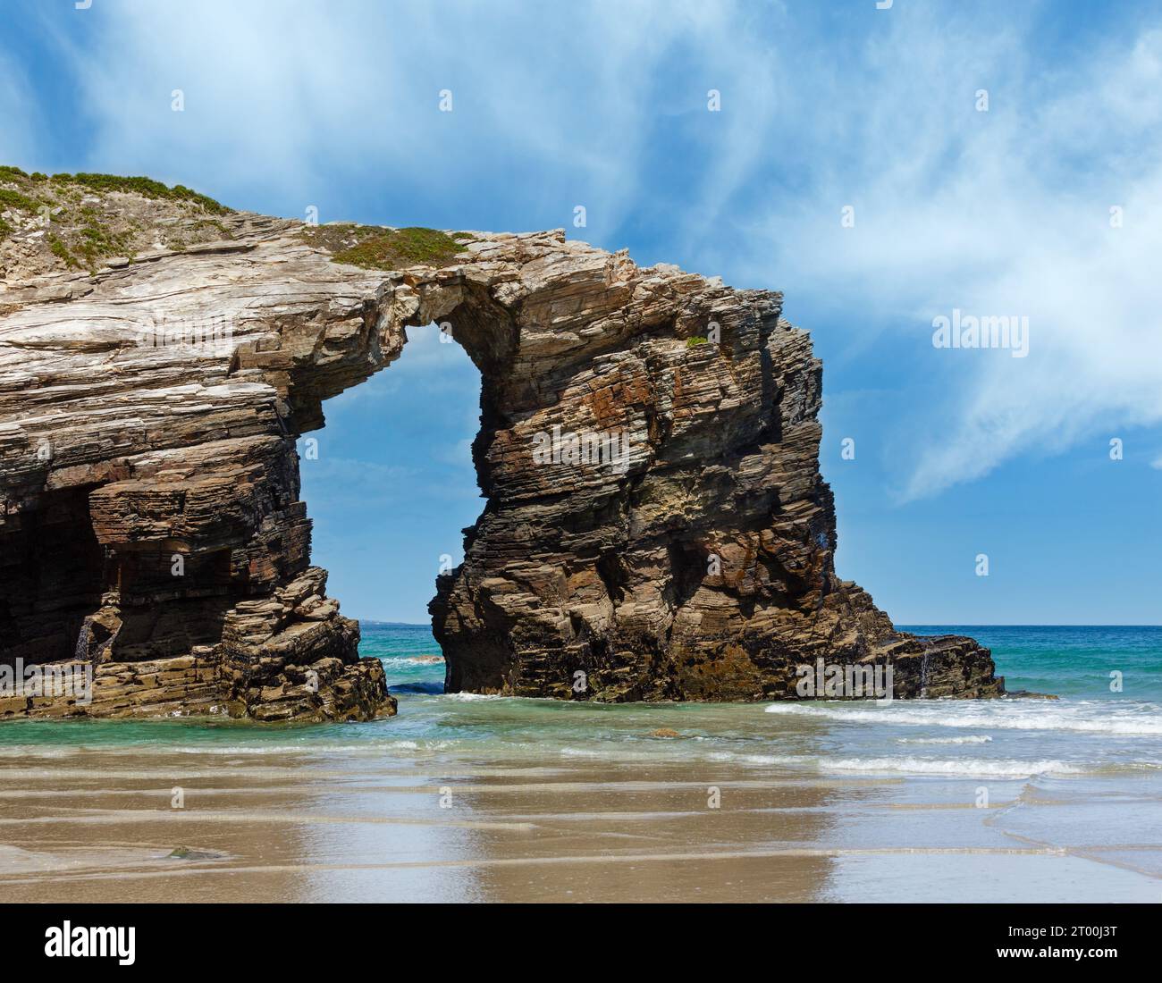Natural arch on beach Stock Photo - Alamy