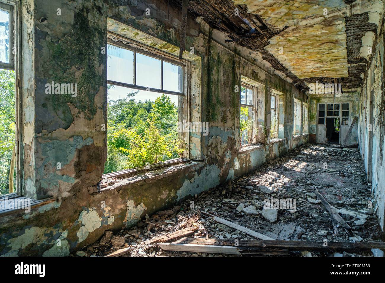 Corridor in old abandoned building, aftermath of wars and disasters ...