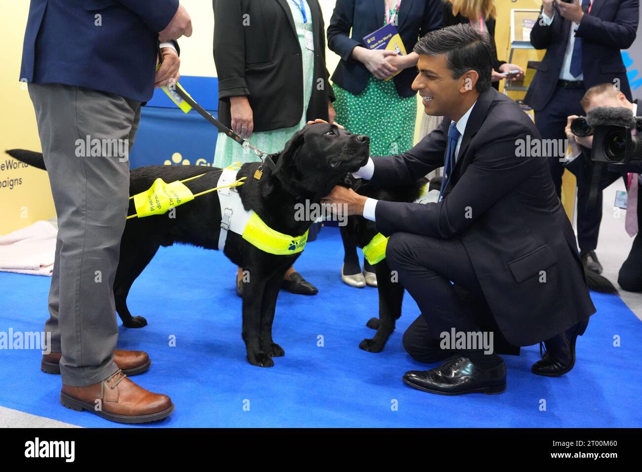 Prime Minister Rishi Sunak greets a guide dog as he tours the Exhibitor ...