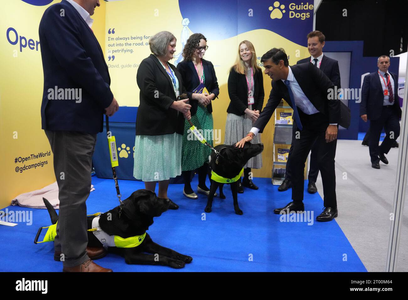 Prime Minister Rishi Sunak greets a guide dog as he tours the Exhibitor ...