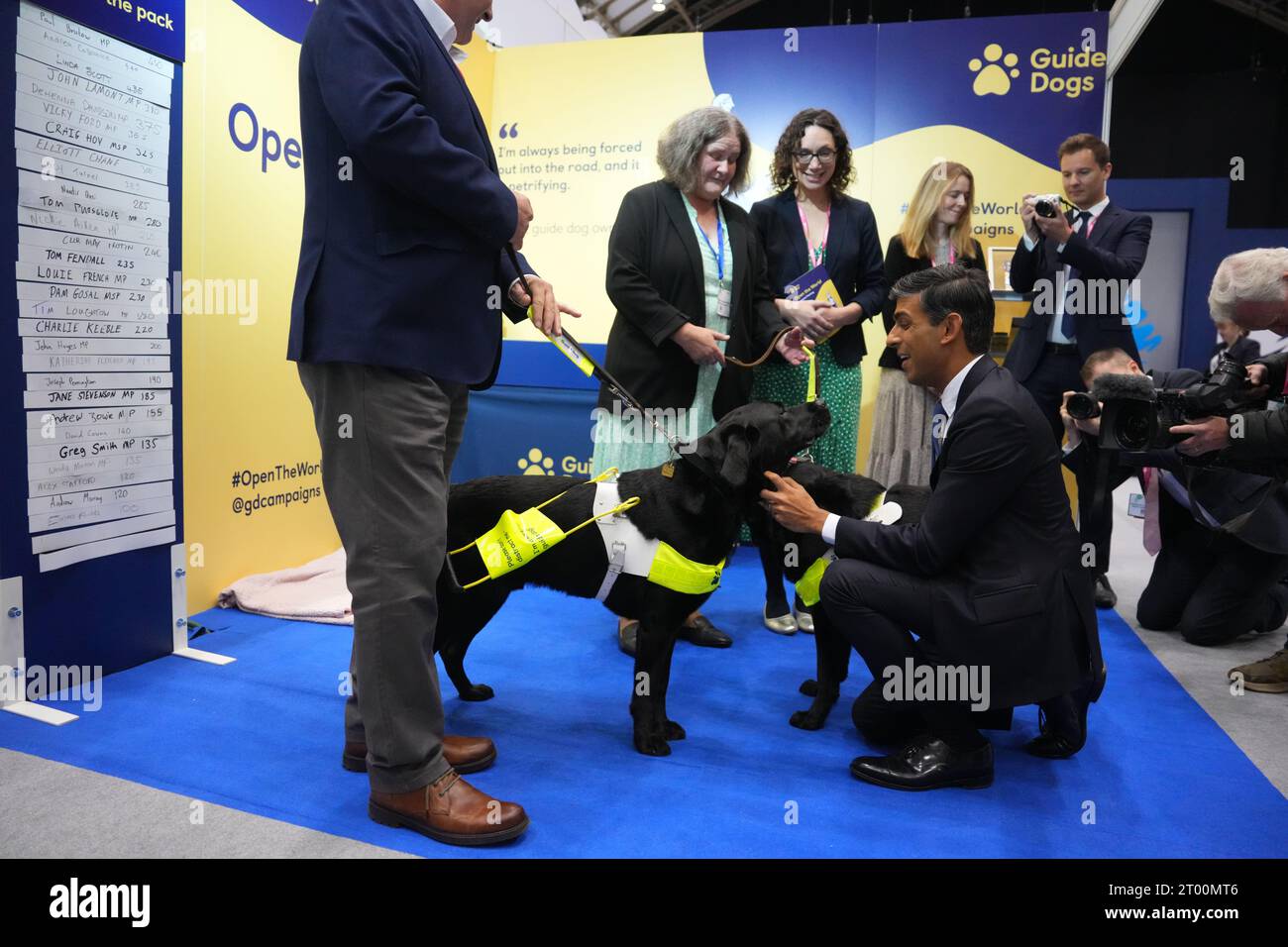 Prime Minister Rishi Sunak greets a guide dog as he tours the Exhibitor ...