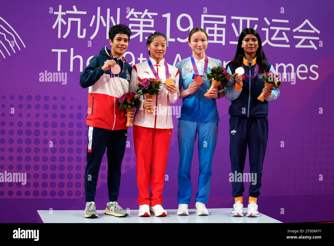 From left, silver medalist Chuthamat Raksat of Thailand, gold medalists ...