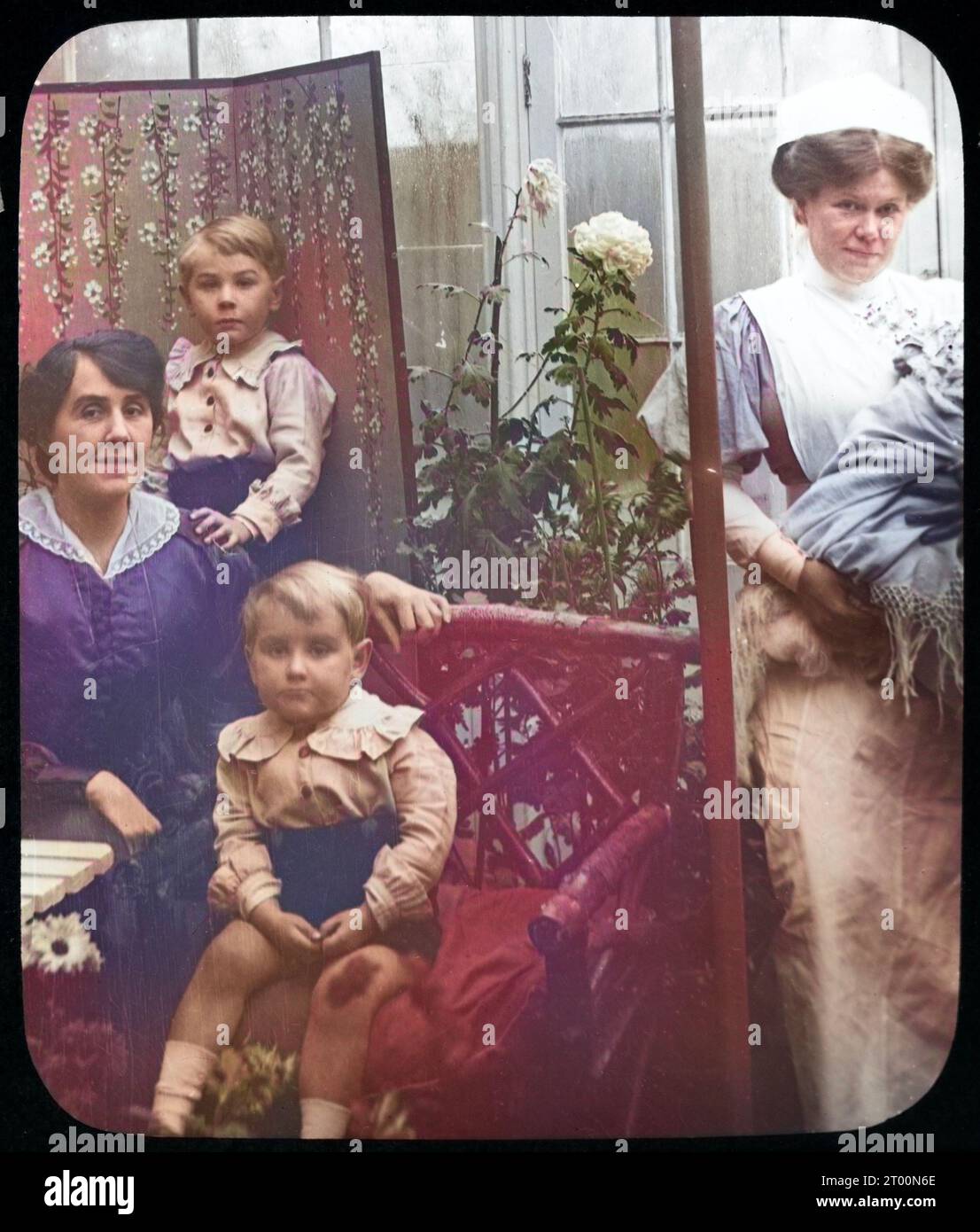 Affluent Edwardian family group indoors with children, mother ...