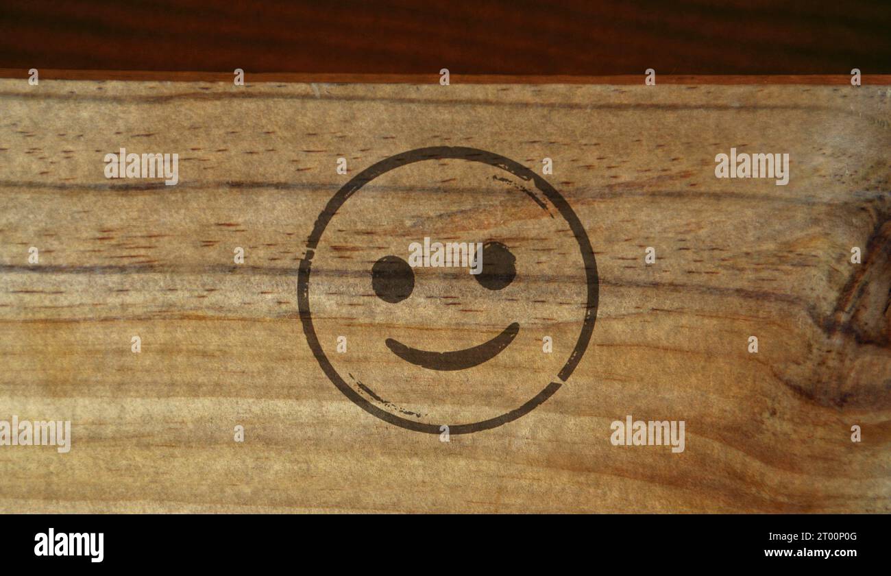 Smiley emoticon icon symbol stamp printed on wooden box. Smile emoji ...