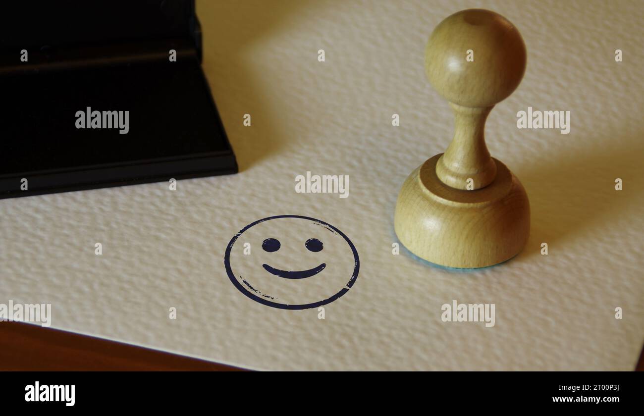 Smiley emoticon stamp and stamping hand. Smile emoji concept Stock ...