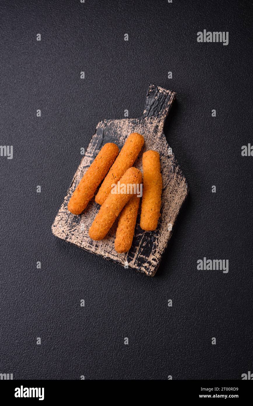 Delicious crispy cheese sticks with mozzarella, salt and spices ...