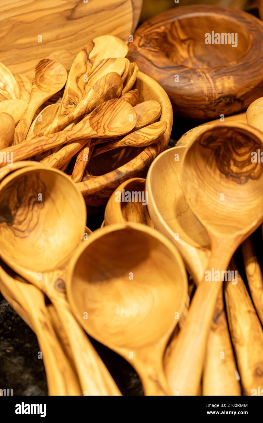 Many wooden cooking spoons and ladles stacked on top of each other to ... Many wooden cooking spoons and ladles stacked on top of each other to ...